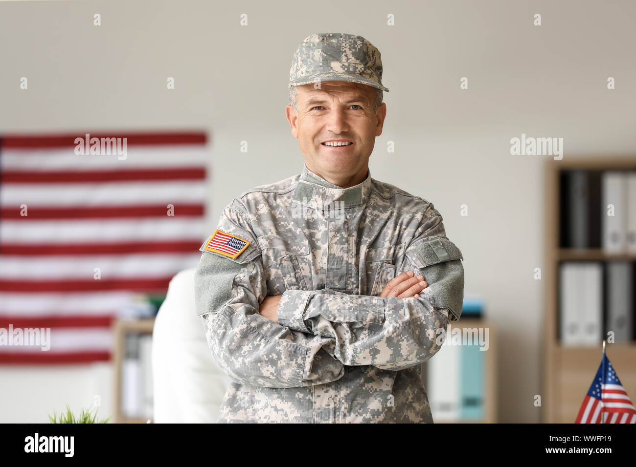 Mature male soldier in headquarters building Stock Photo - Alamy
