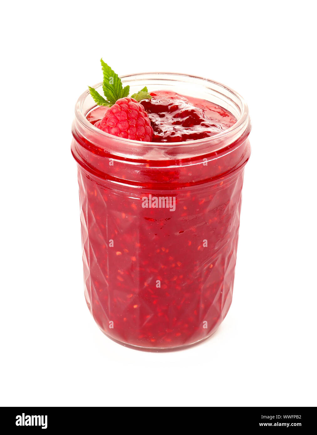 Jar of tasty raspberry jam on white background Stock Photo - Alamy