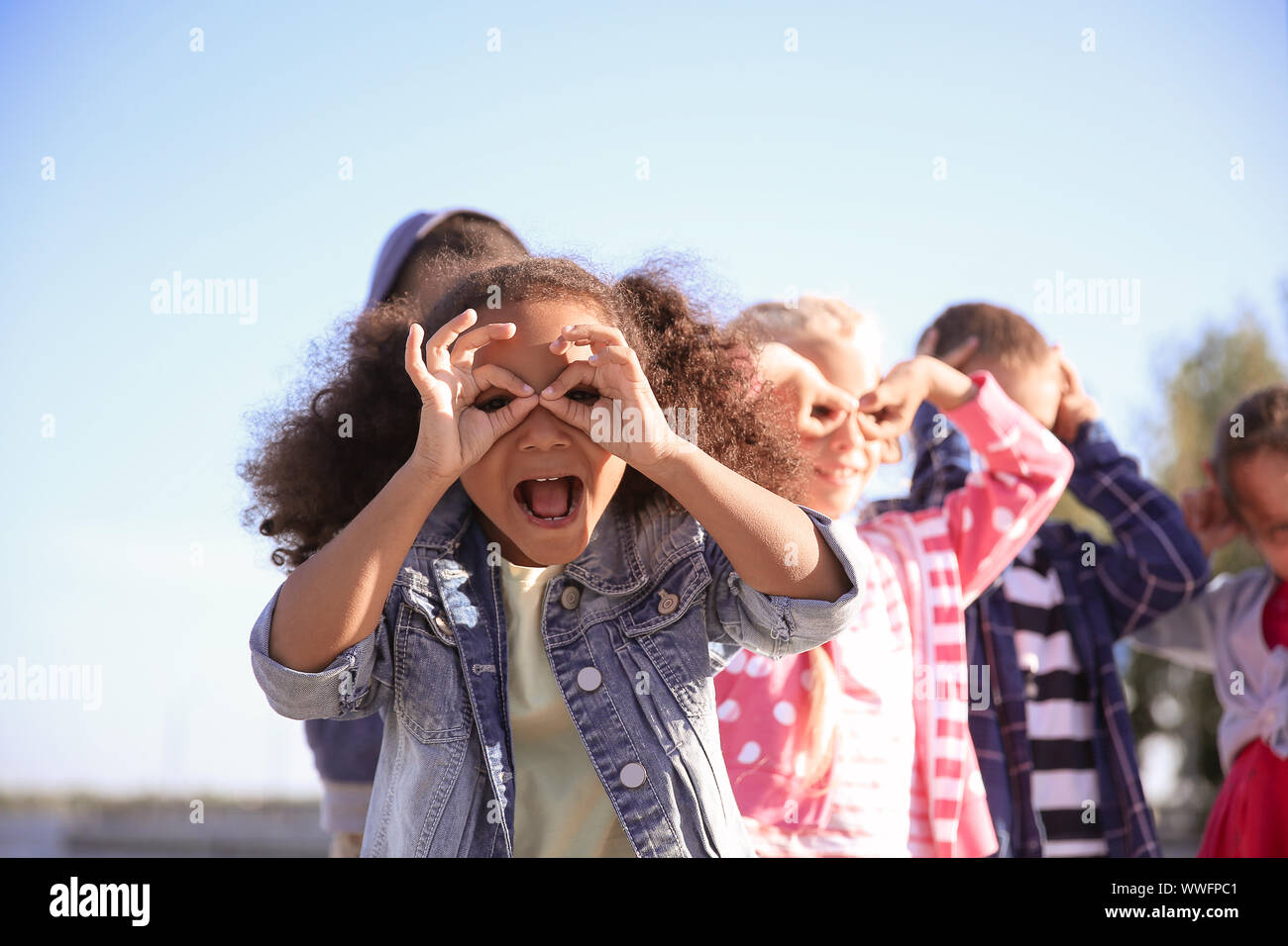 Group of happy children having fun outdoors Stock Photo - Alamy