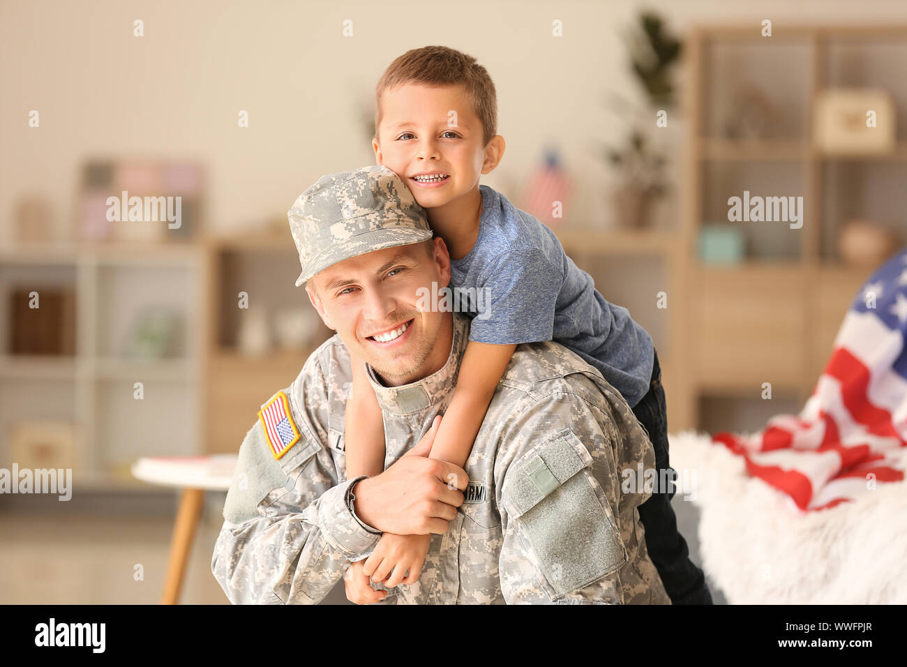 Happy military man with his son at home Stock Photo - Alamy