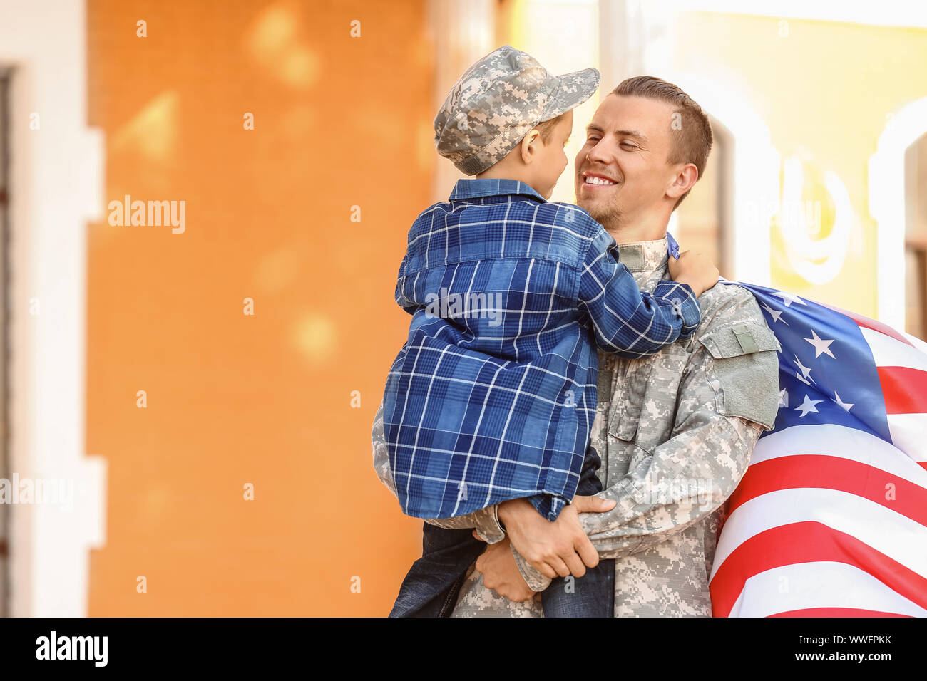 Happy military man with his son outdoors Stock Photo - Alamy