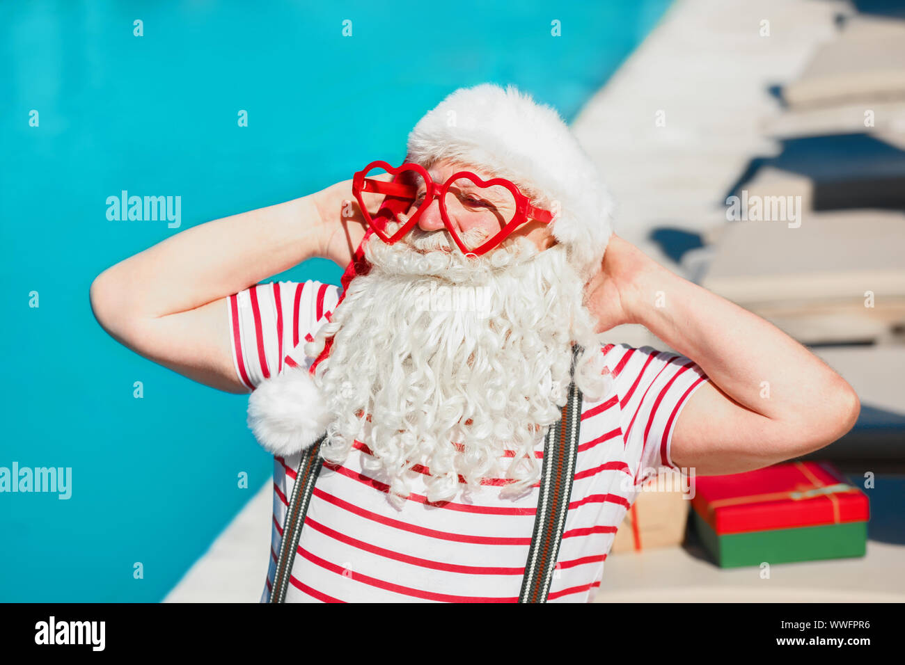 Santa Claus near swimming pool at resort Stock Photo - Alamy