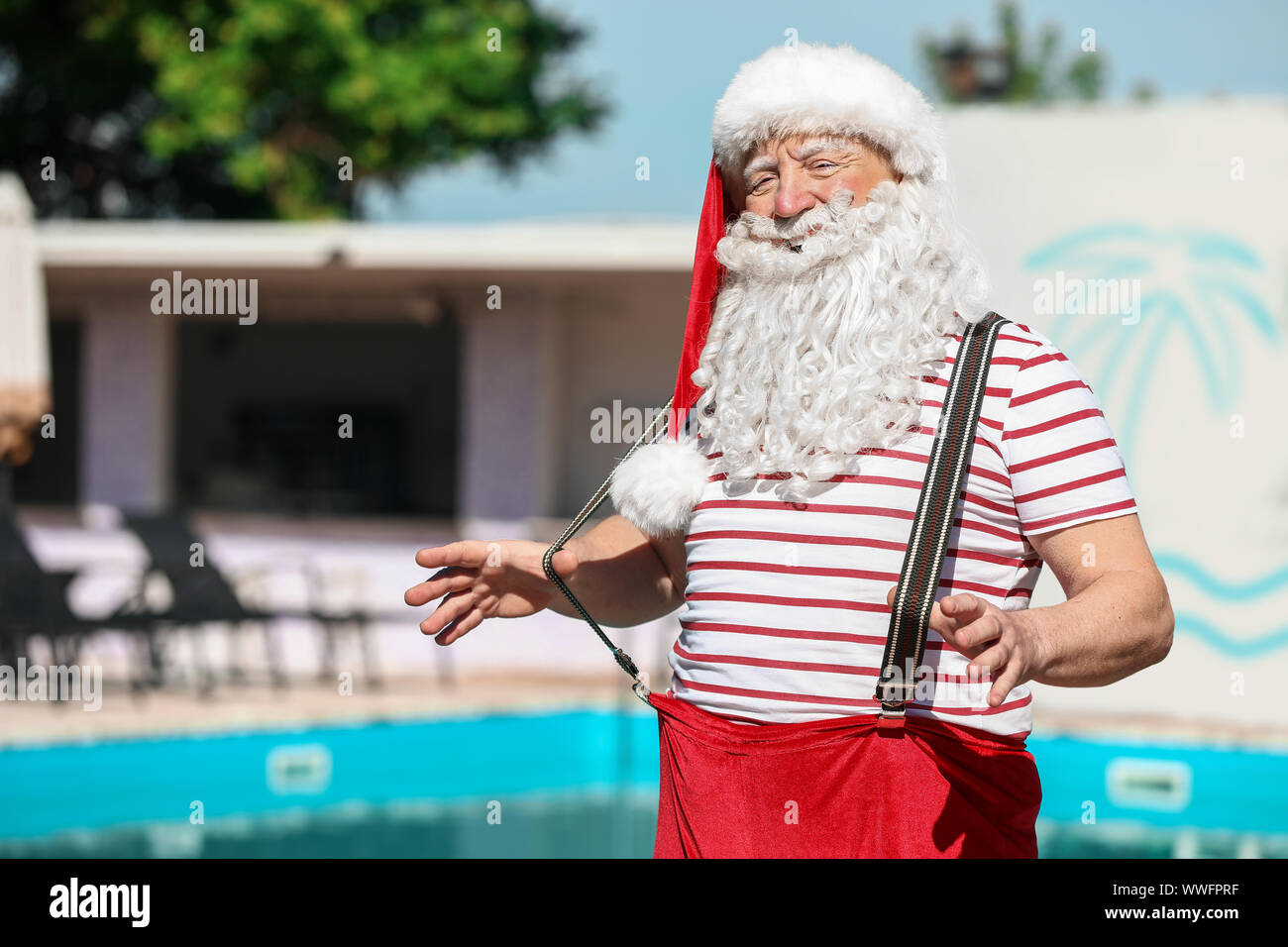 Santa Claus near swimming pool at resort Stock Photo - Alamy