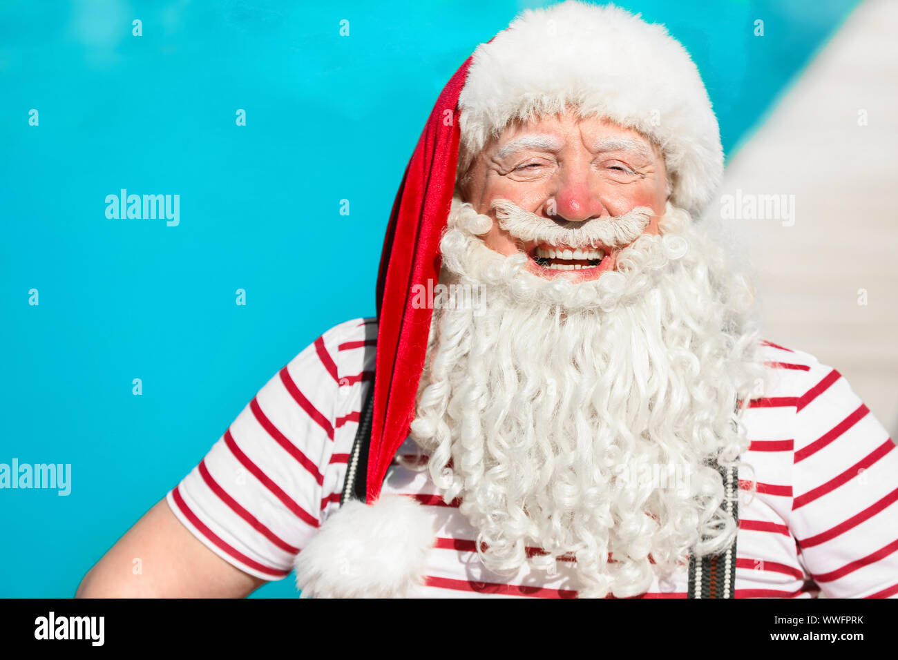 Santa Claus near swimming pool at resort Stock Photo - Alamy