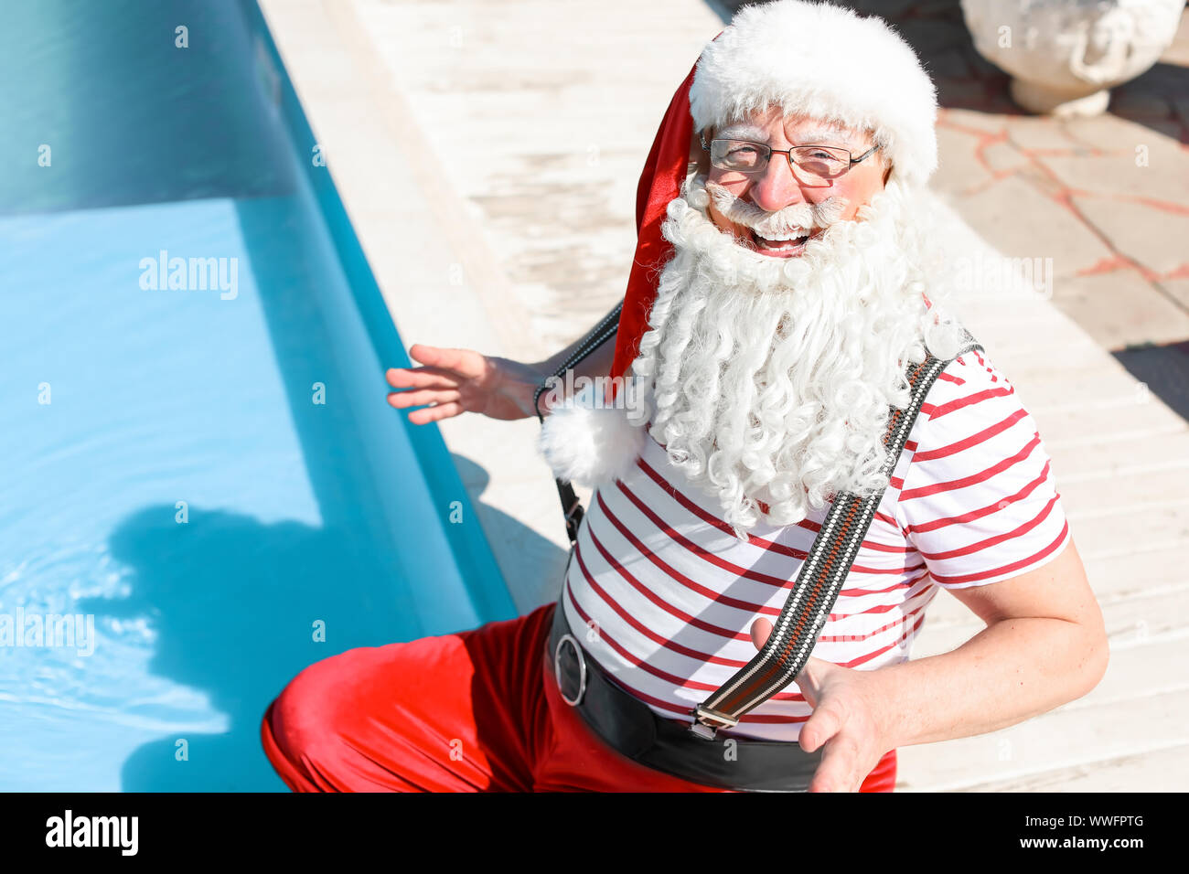 Santa Claus near swimming pool at resort Stock Photo - Alamy