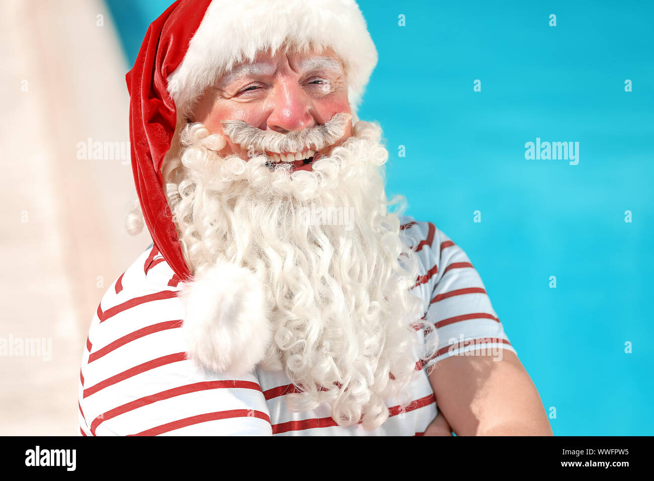 Santa Claus near swimming pool at resort Stock Photo - Alamy