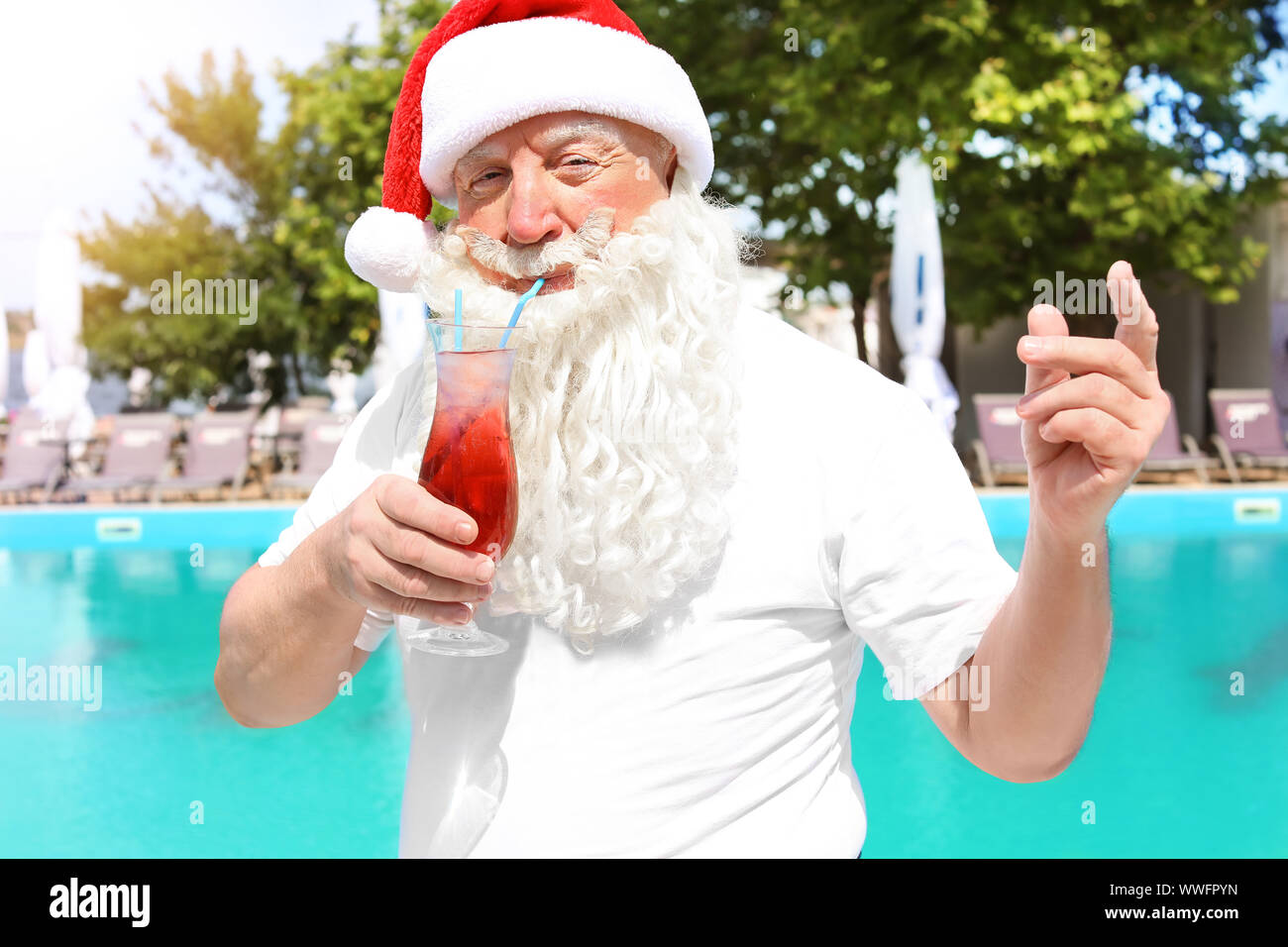 Santa Claus with cocktail at resort Stock Photo - Alamy