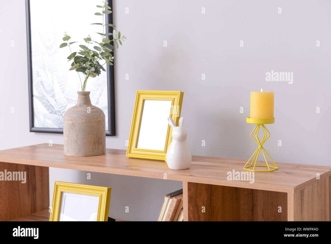 Wooden rack with stylish decor in room Stock Photo - Alamy