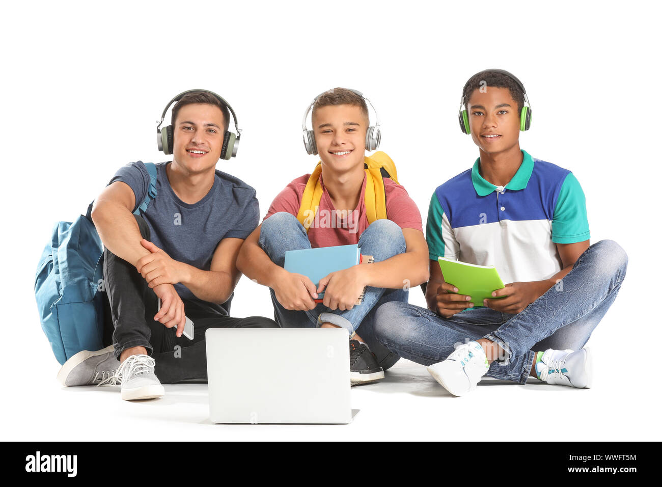 Portrait of young students with laptop on white background Stock Photo ...