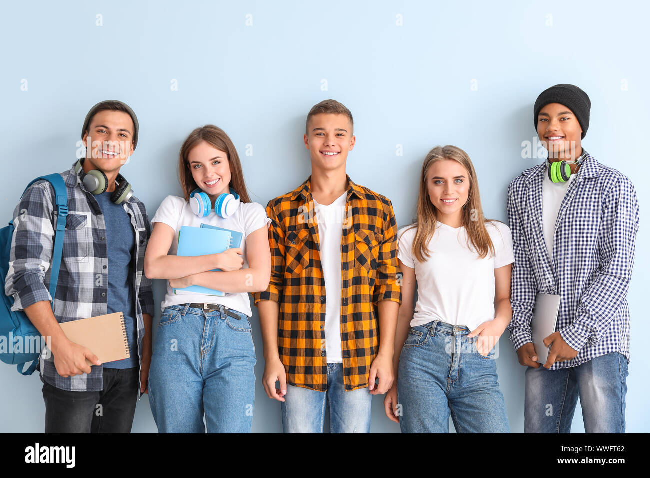 Portrait of young students on color background Stock Photo - Alamy