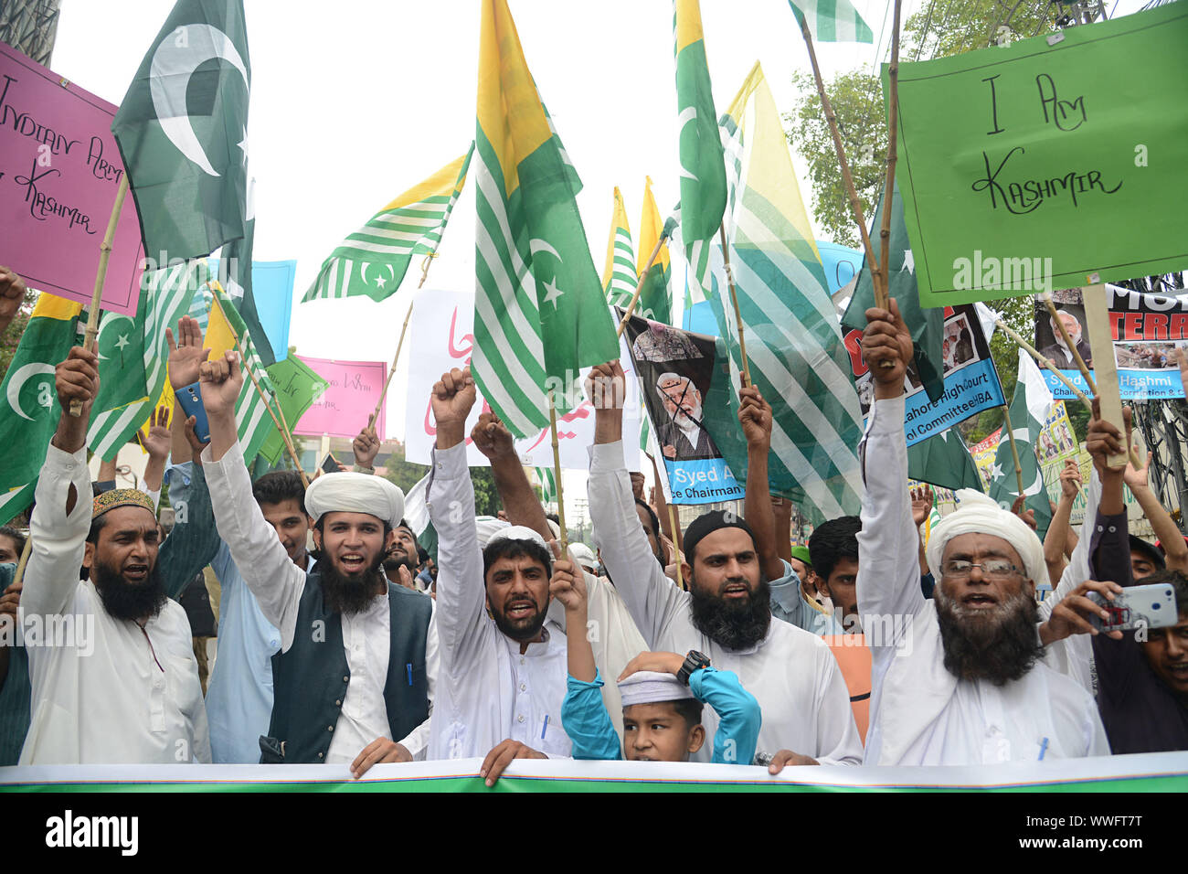 Lahore, Pakistan. 15th Sep, 2019. Pakistani hold placards, banners ...