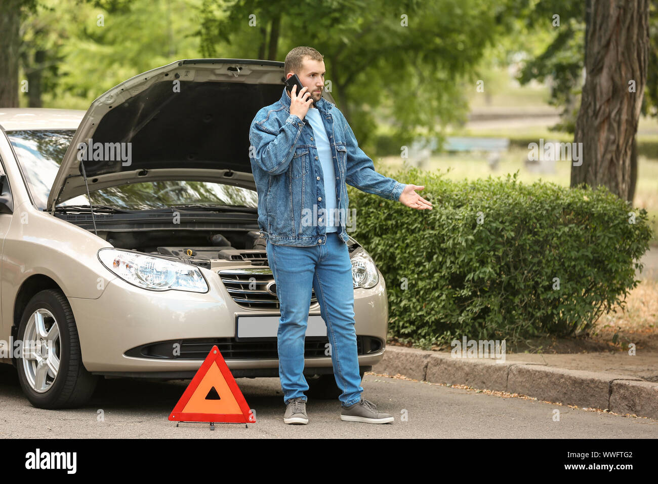 Car standing near stop sign hi-res stock photography and images - Alamy