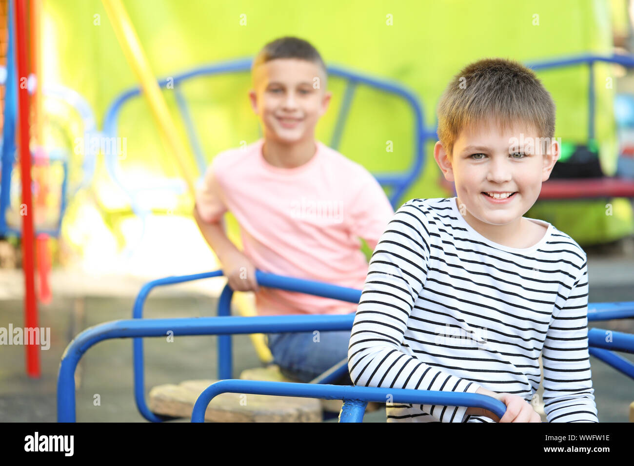 Cute little children on playground Stock Photo - Alamy