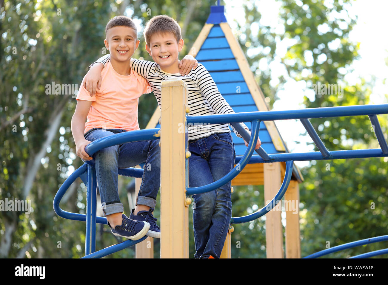 Cute little children on playground Stock Photo - Alamy