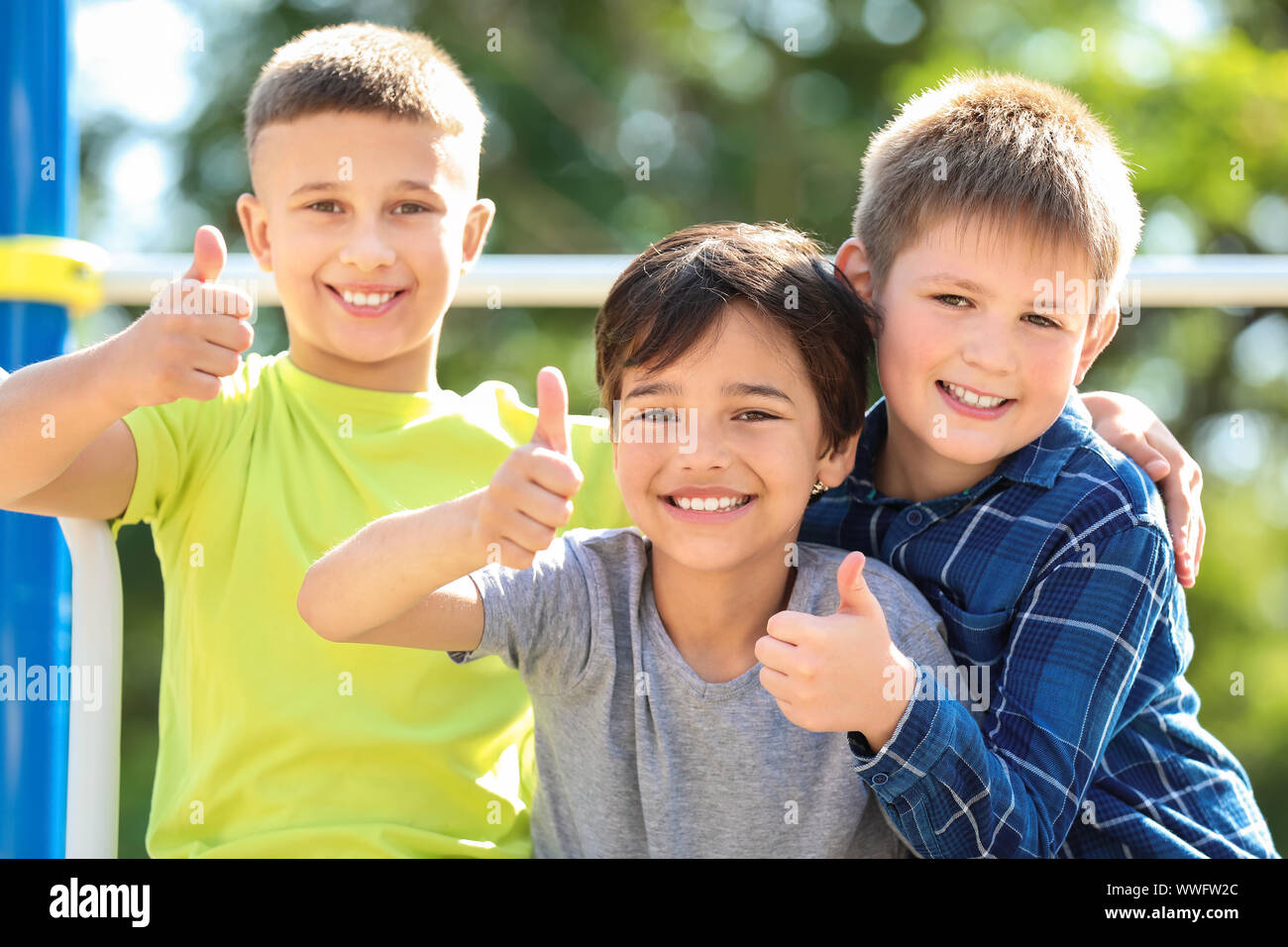 Cute little children on playground Stock Photo - Alamy