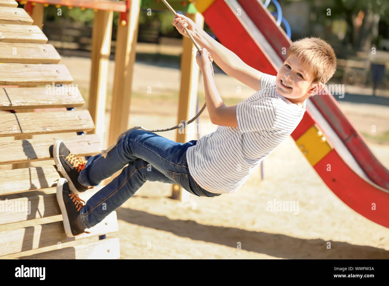 Cute little boy on playground Stock Photo - Alamy