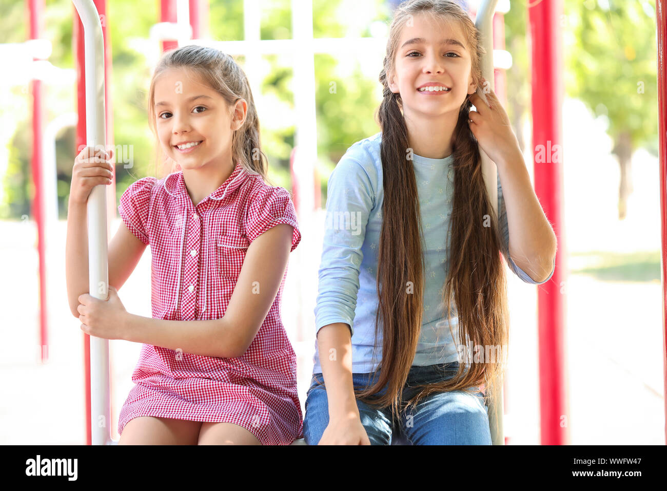 Cute little girls on playground Stock Photo - Alamy