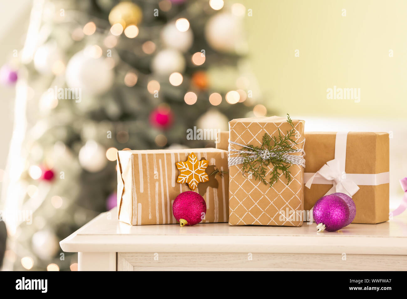 Beautiful gift boxes on table in room Stock Photo - Alamy