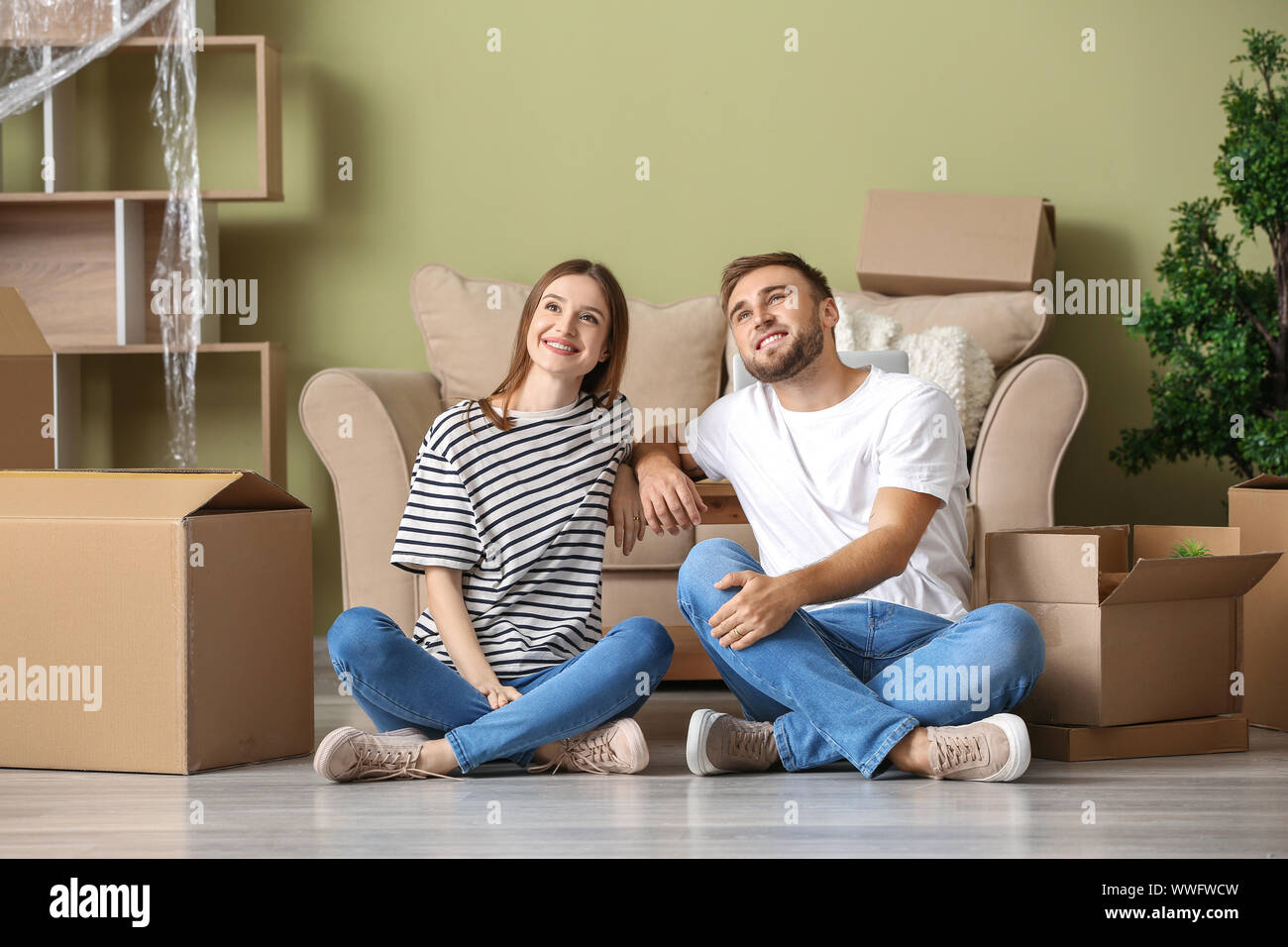 Young couple planning design of their new house Stock Photo - Alamy
