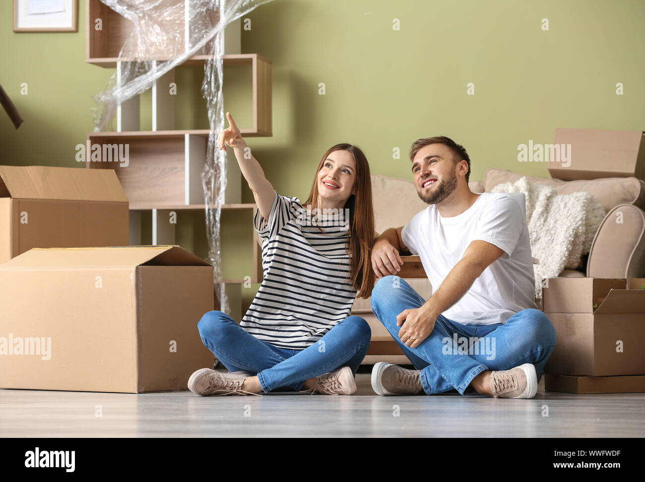 Young couple planning design of their new house Stock Photo - Alamy