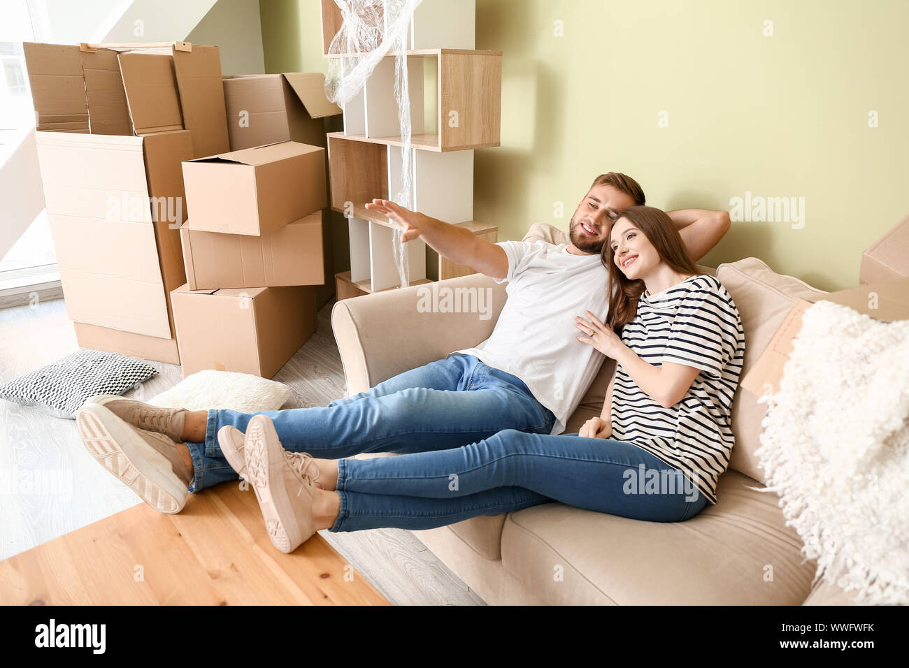 Young couple planning design of their new house Stock Photo - Alamy
