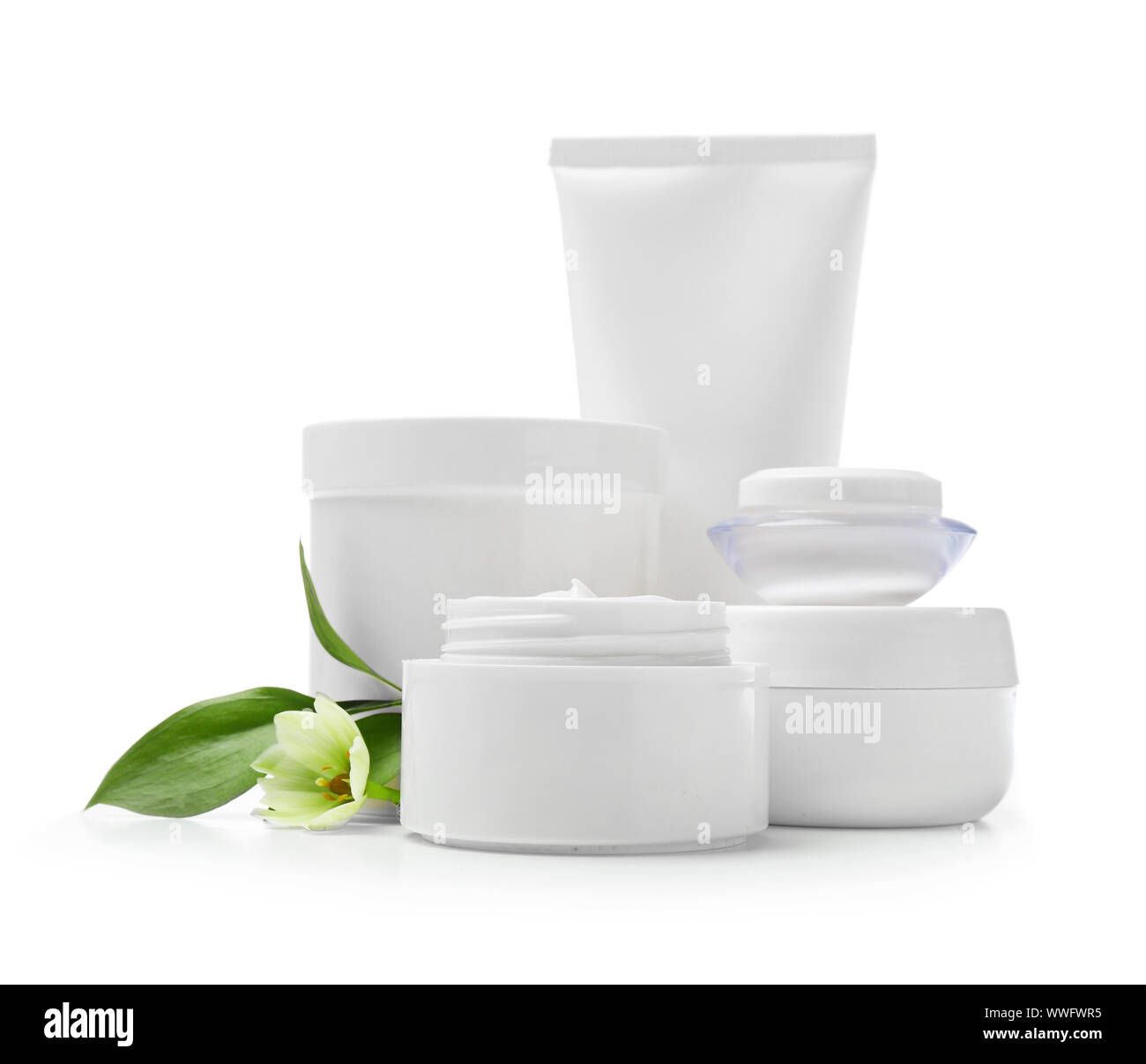 Different body cream on white background Stock Photo - Alamy
