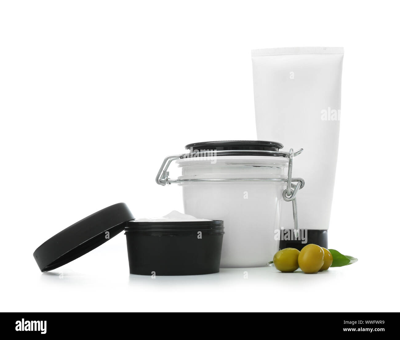 Different body cream on white background Stock Photo - Alamy