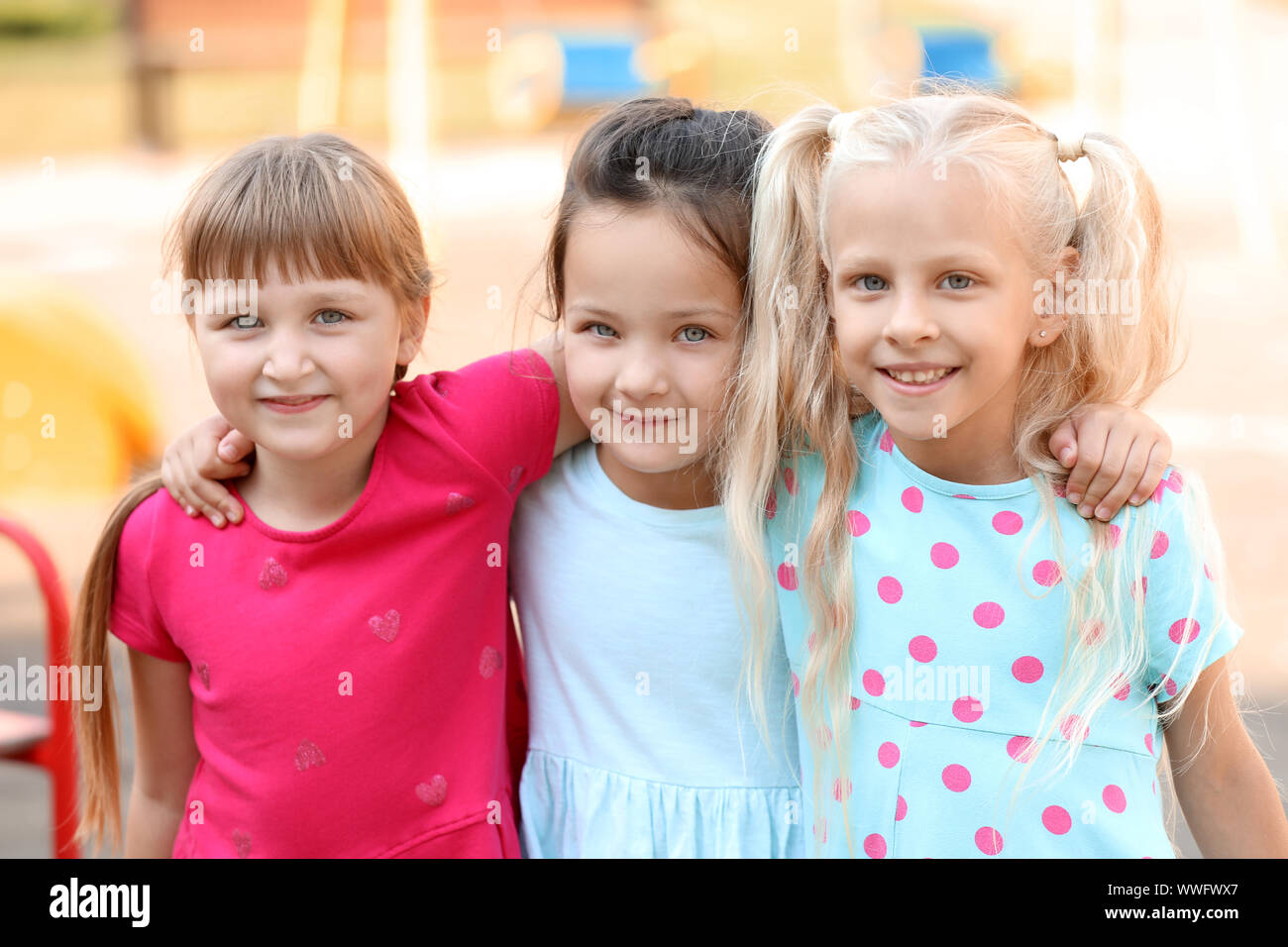 Cute little children on playground Stock Photo - Alamy