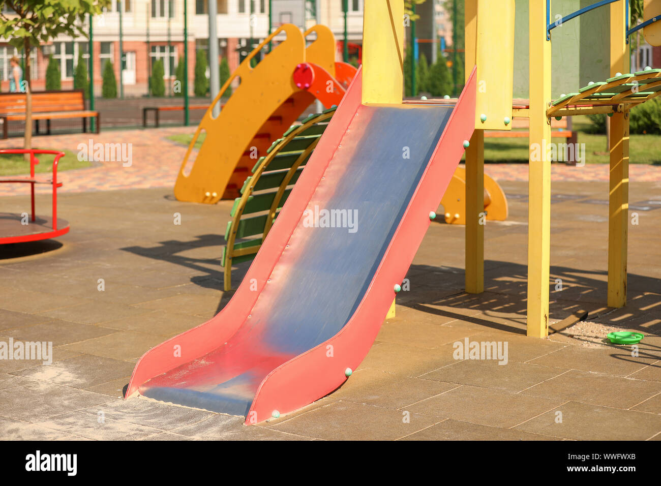 Slide on playground in park Stock Photo - Alamy
