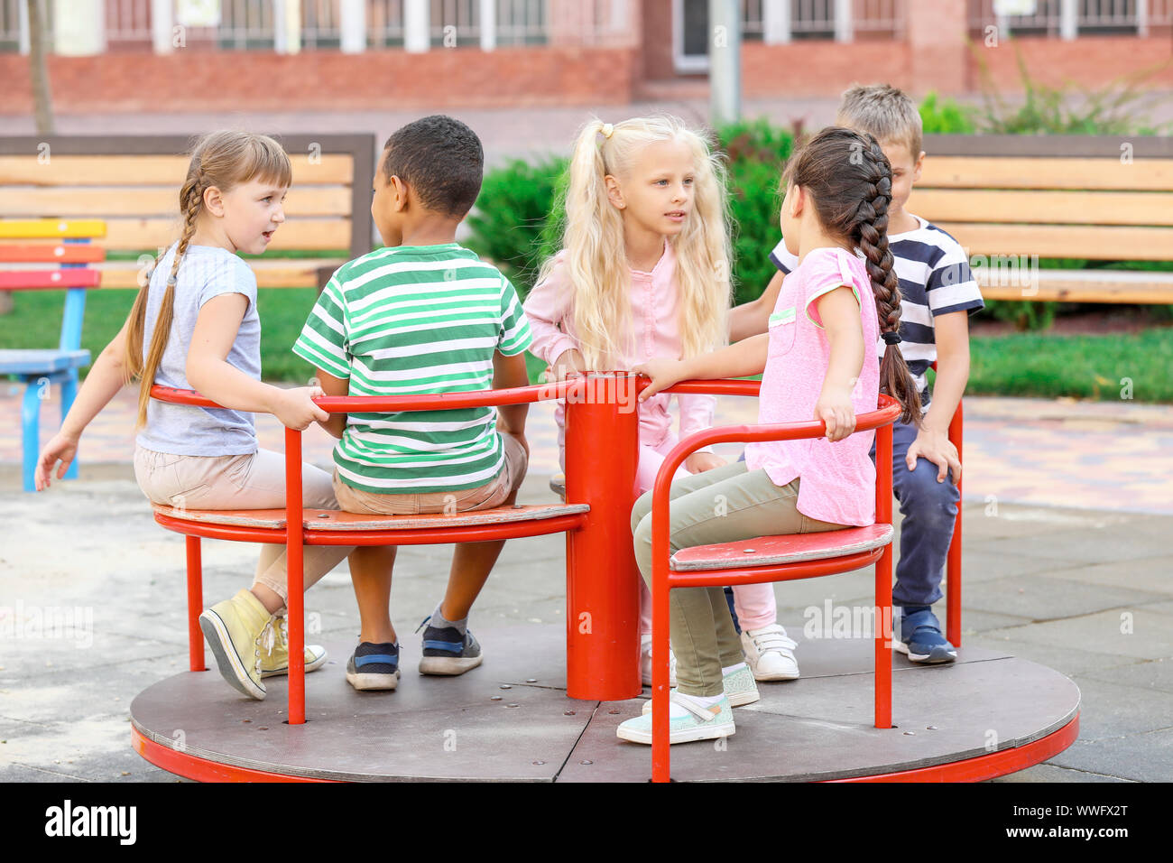 Cute little children on playground Stock Photo - Alamy