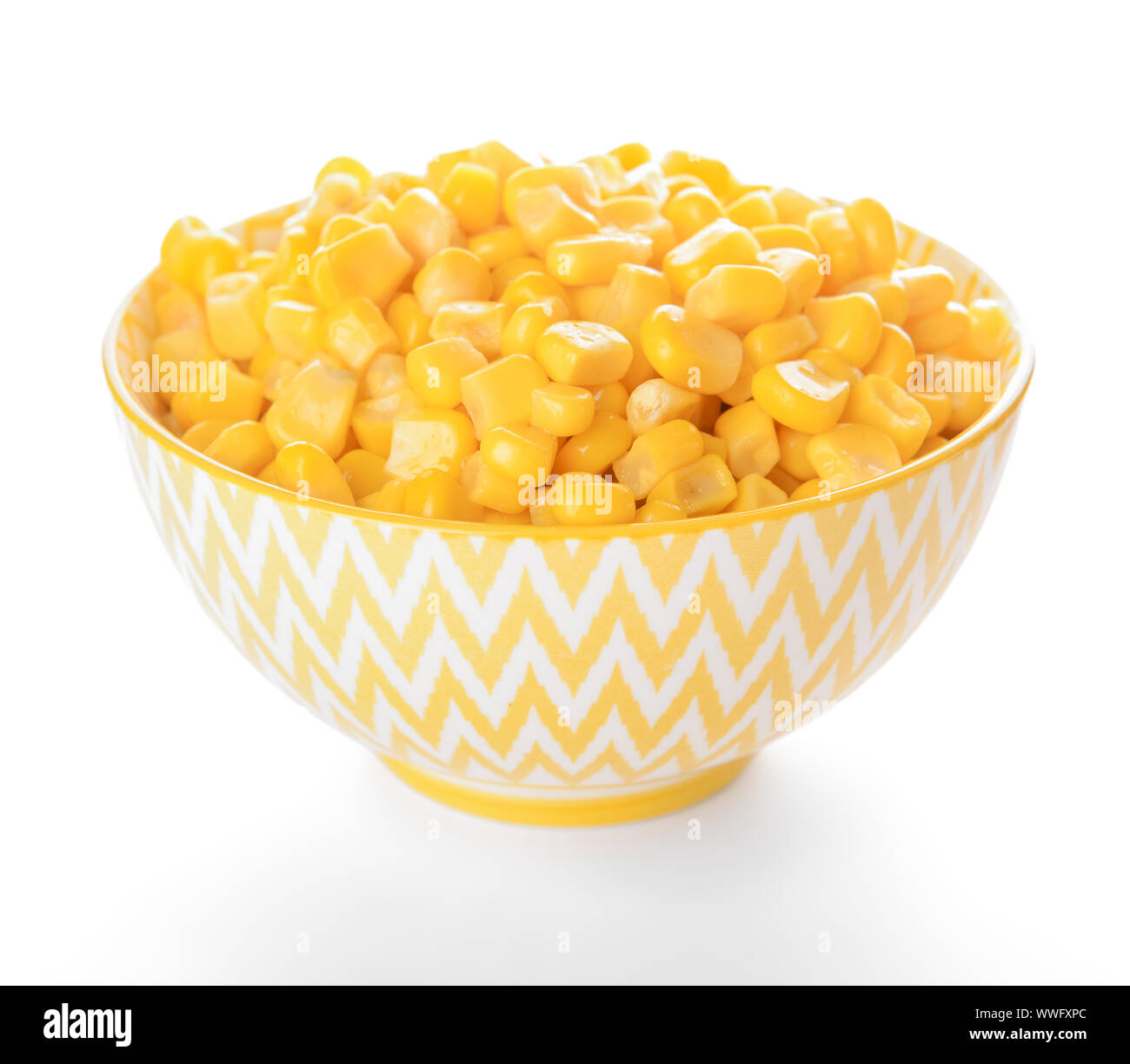 Bowl with corn kernels on white background Stock Photo - Alamy