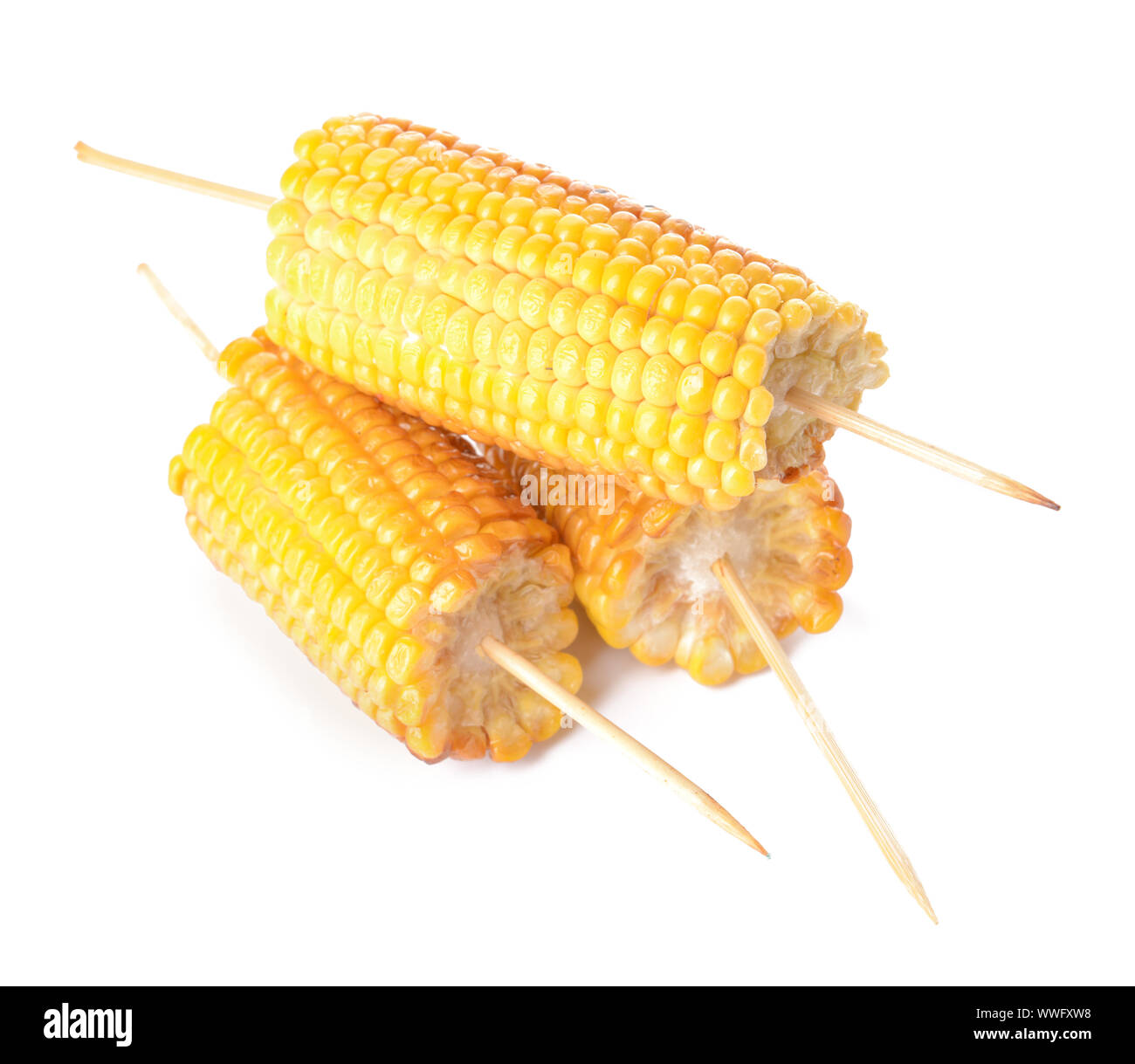 Sticks with tasty grilled corn cobs on white background Stock Photo - Alamy