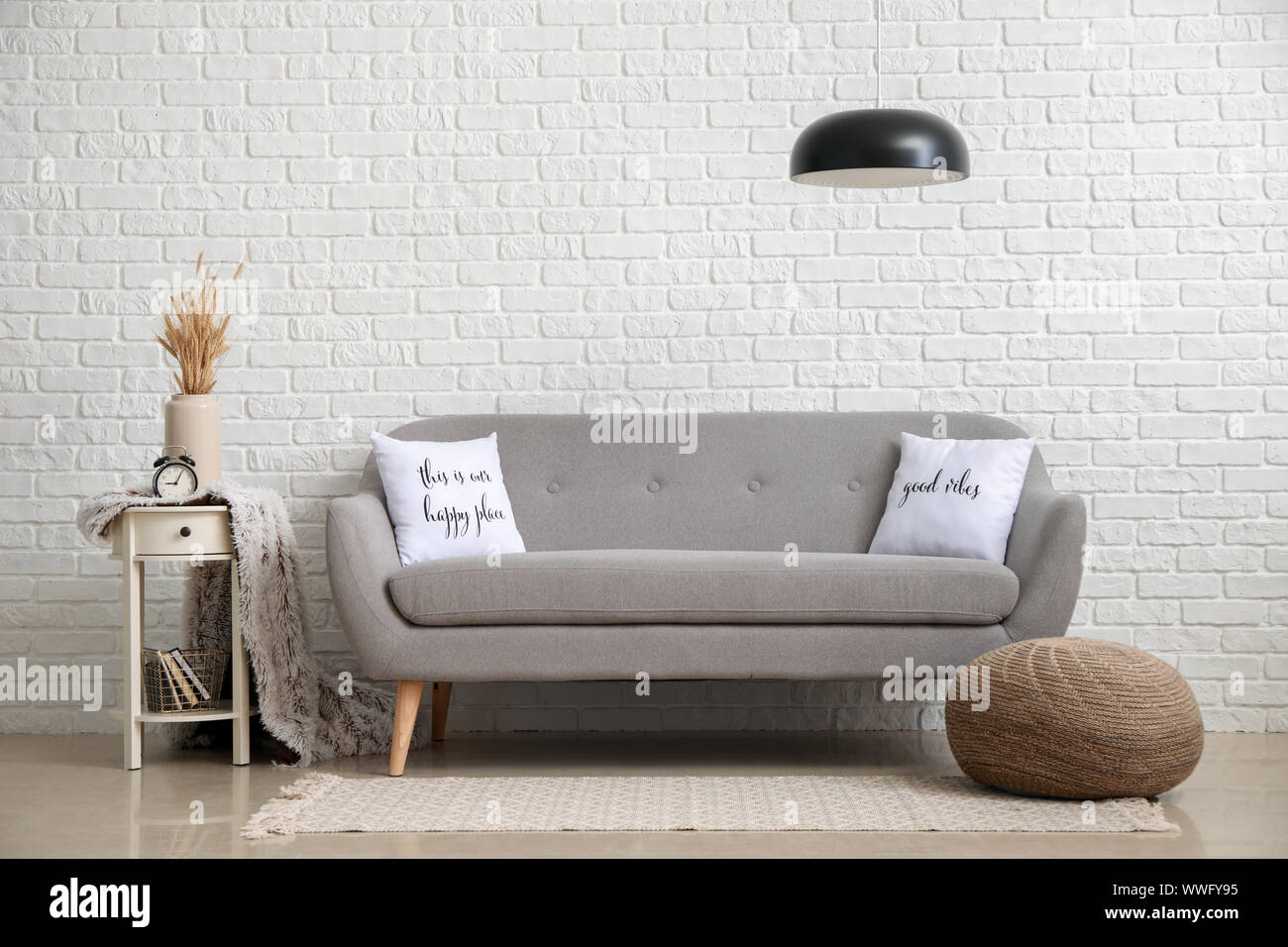 Interior of modern room with comfortable sofa Stock Photo - Alamy