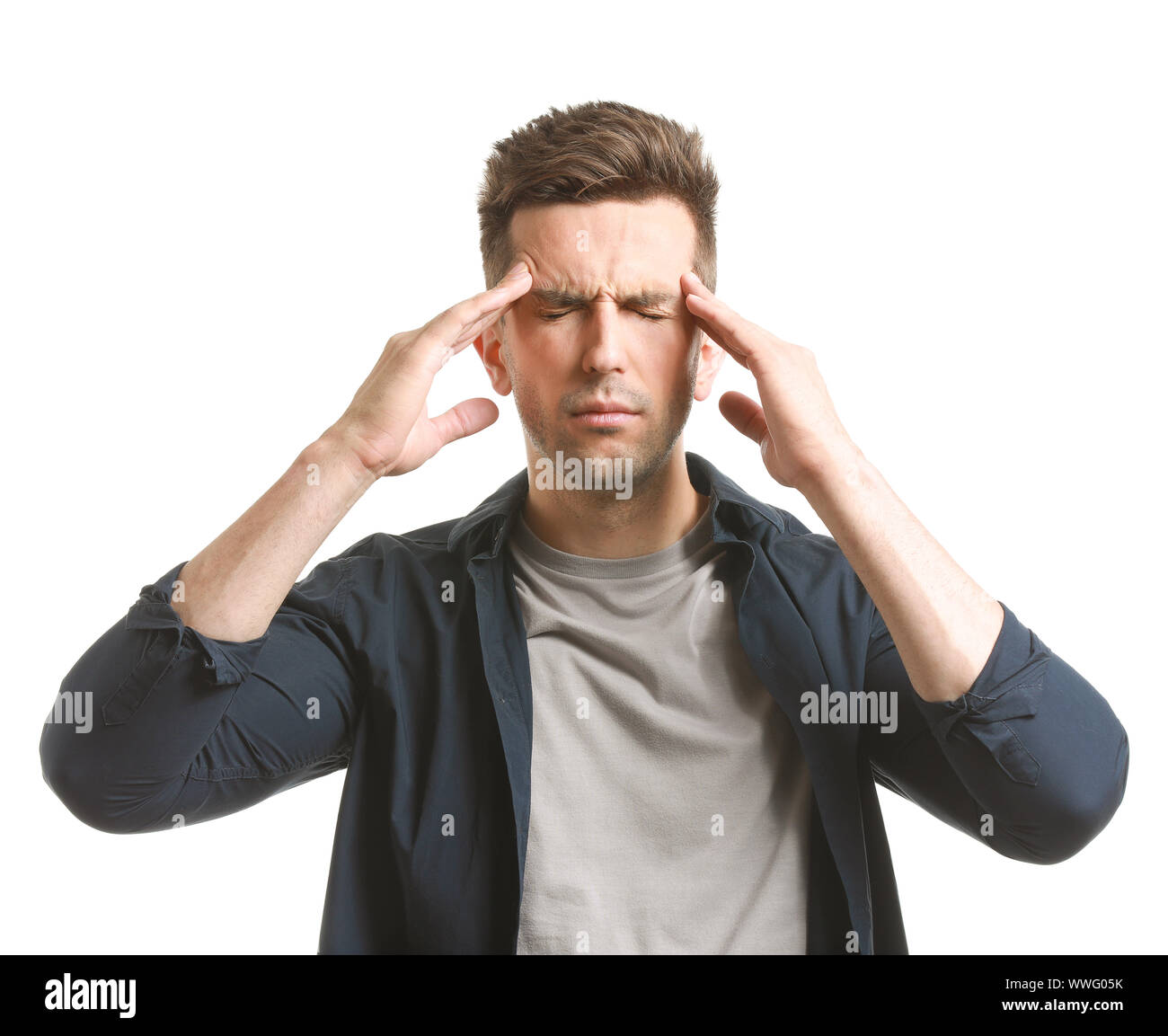 Stressed young man on white background Stock Photo - Alamy