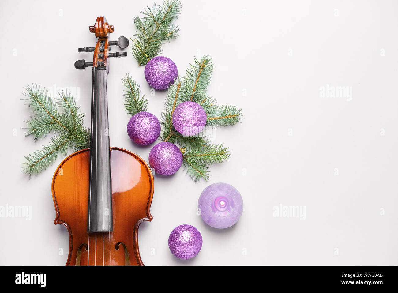 Violin and Christmas decor on light background Stock Photo - Alamy