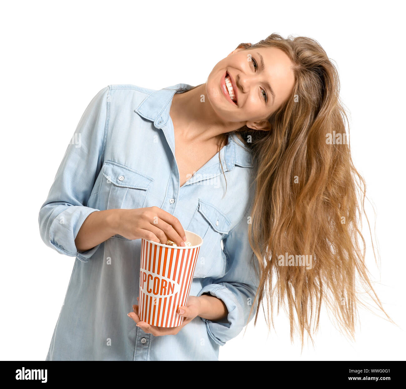 Young woman with popcorn on white background Stock Photo - Alamy