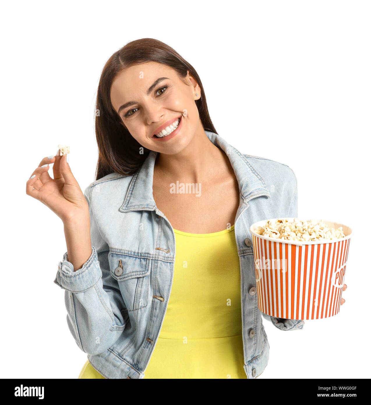 Young woman with popcorn on white background Stock Photo - Alamy