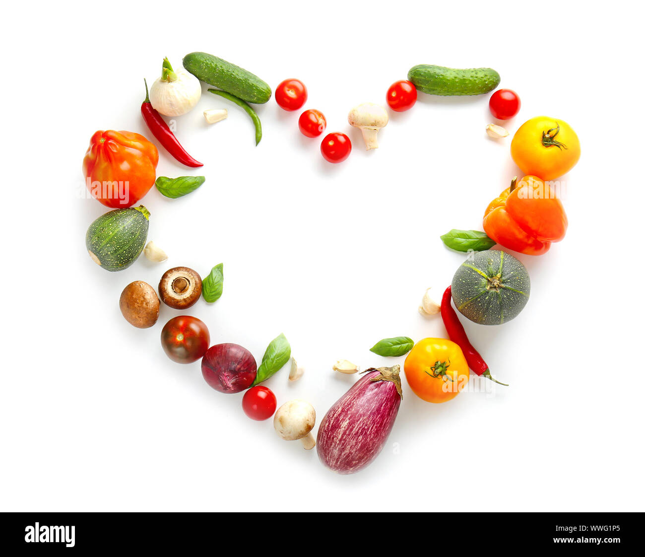 Heart made of different fresh vegetables on white background Stock ...