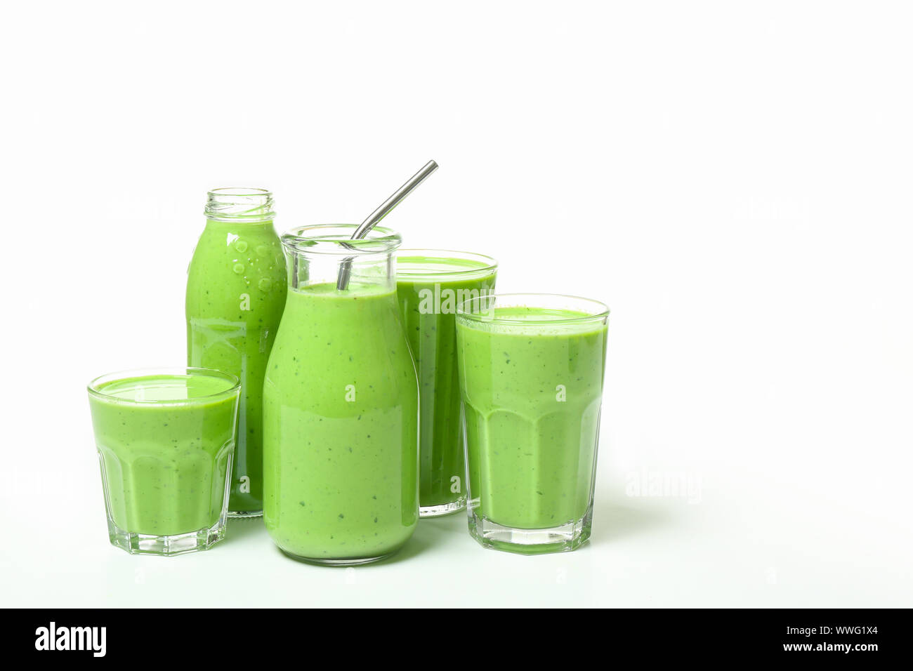 Glassware with healthy smoothie on white background Stock Photo - Alamy