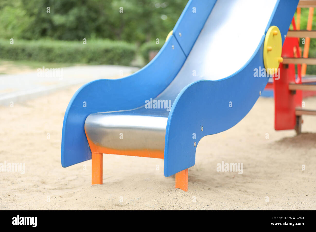Slide on playground in park Stock Photo - Alamy