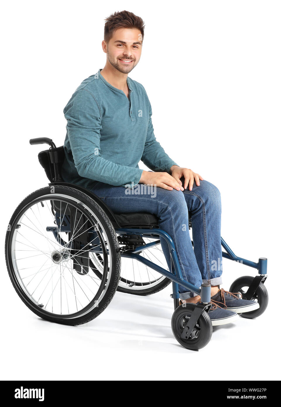 Handsome man in wheelchair on white background Stock Photo - Alamy