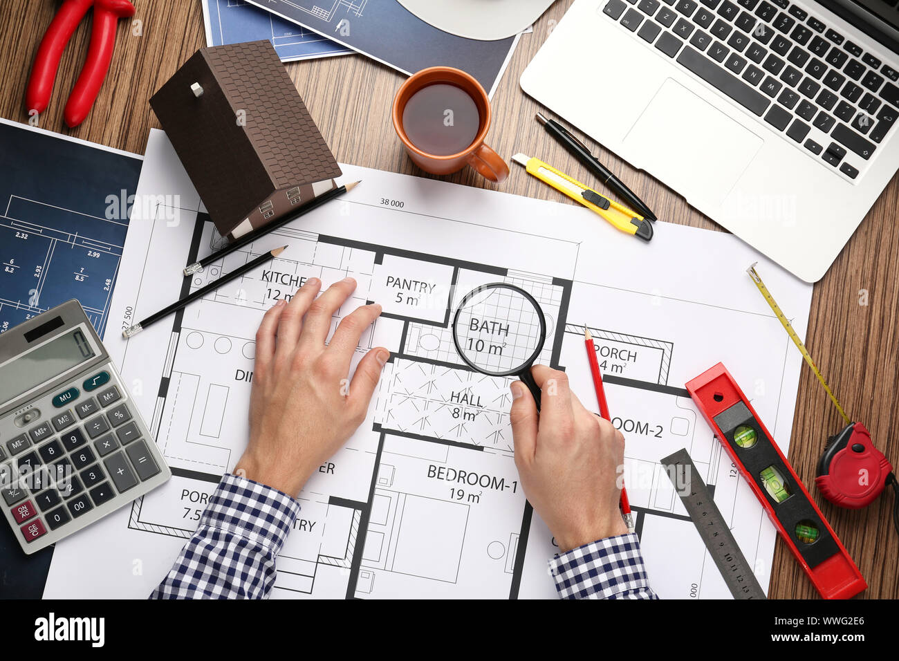 Male architect working at table, top view Stock Photo - Alamy
