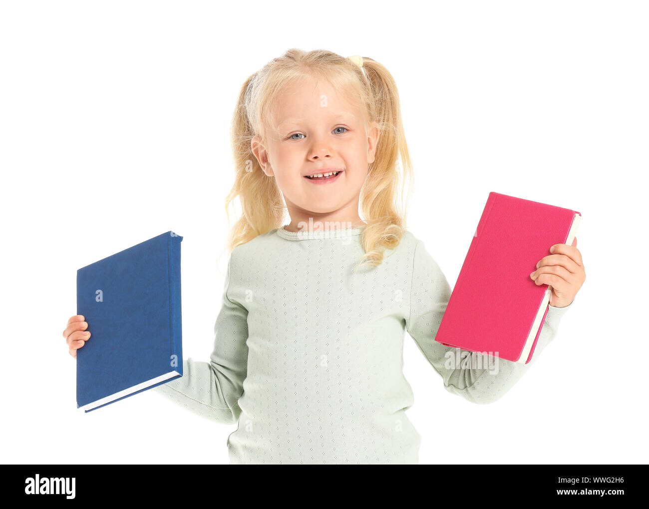 Cute little girl with books on white background Stock Photo - Alamy