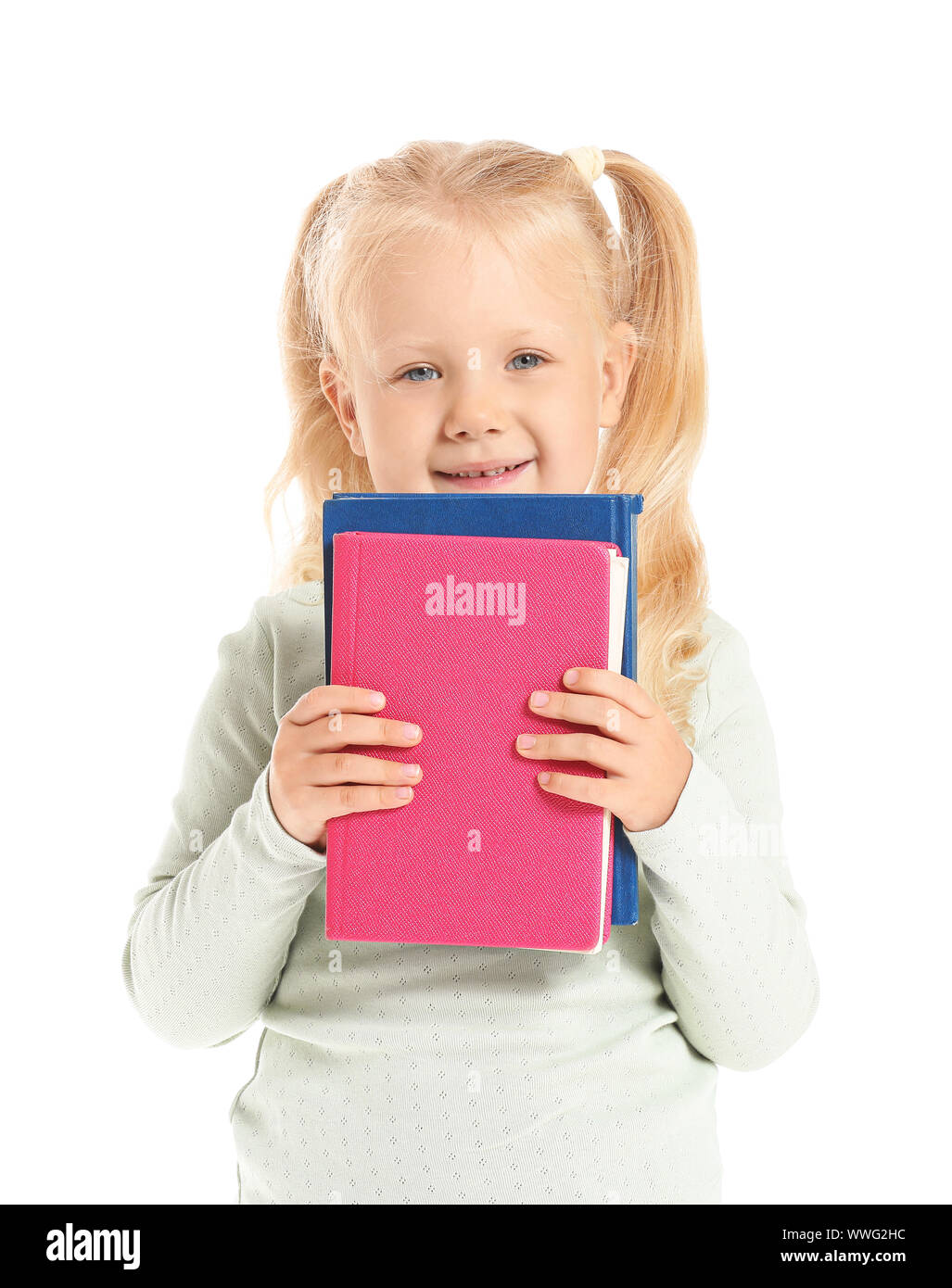 Cute little girl with books on white background Stock Photo - Alamy