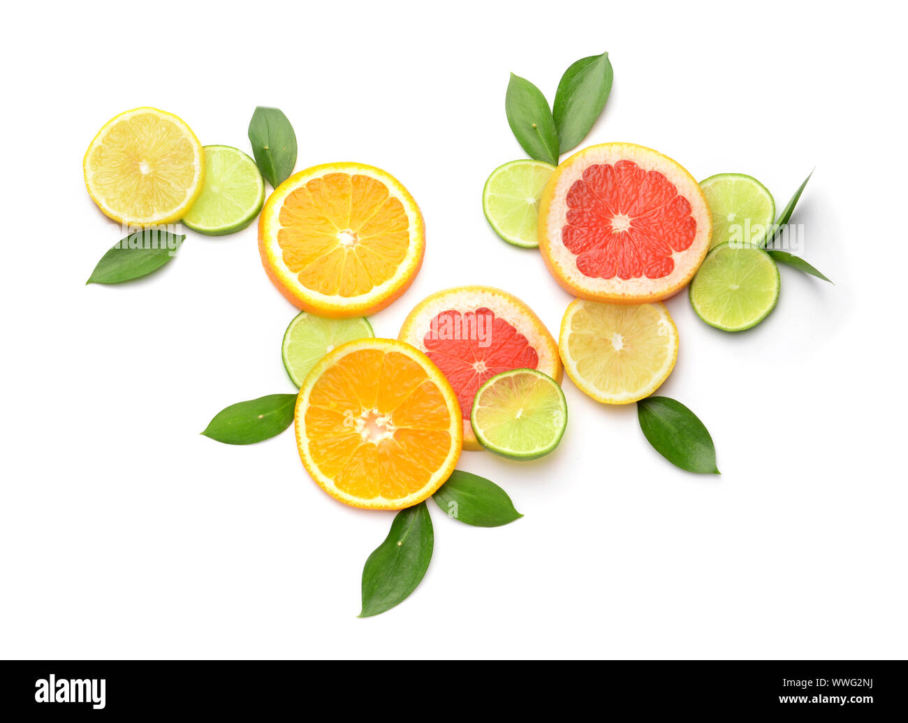 Different sliced citrus fruits on white background Stock Photo - Alamy