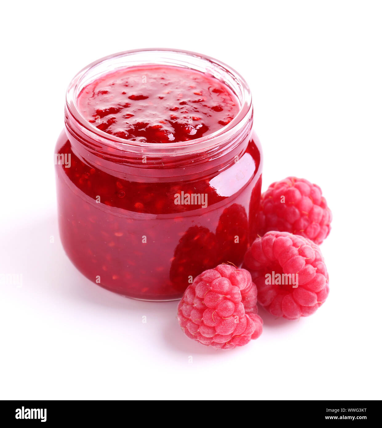 Jar of tasty raspberry jam on white background Stock Photo - Alamy