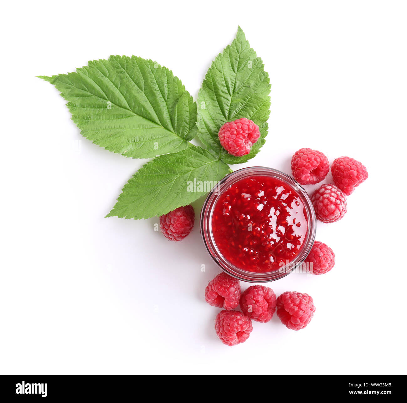 Jar of tasty raspberry jam on white background Stock Photo - Alamy