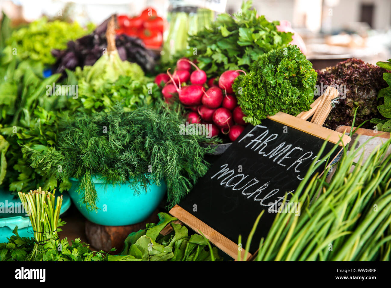 Assortment of fresh herbs on counter at farmer's market Stock Photo - Alamy