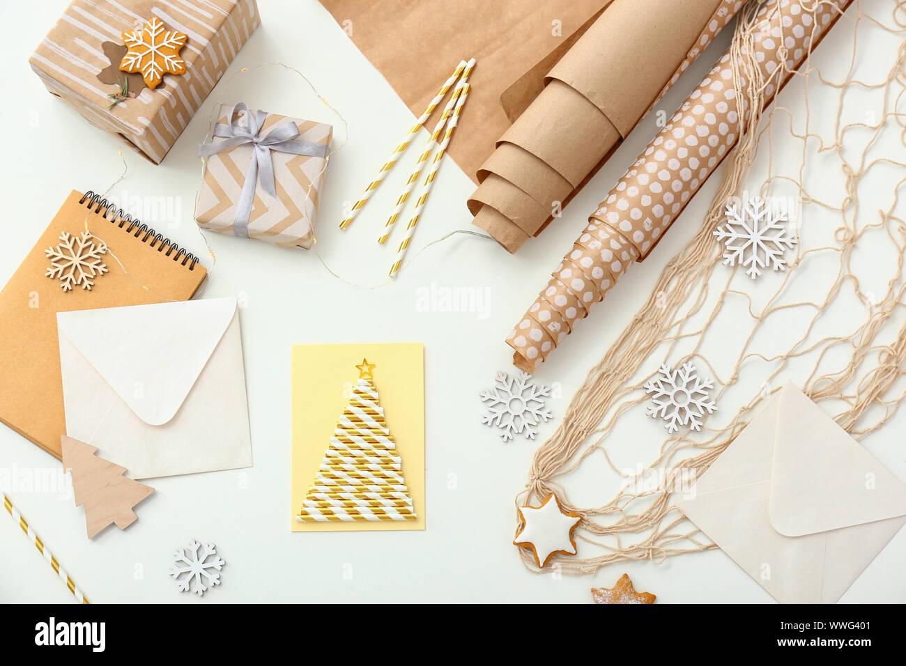 Handmade greeting card with wrapping paper and gift boxes on white ...