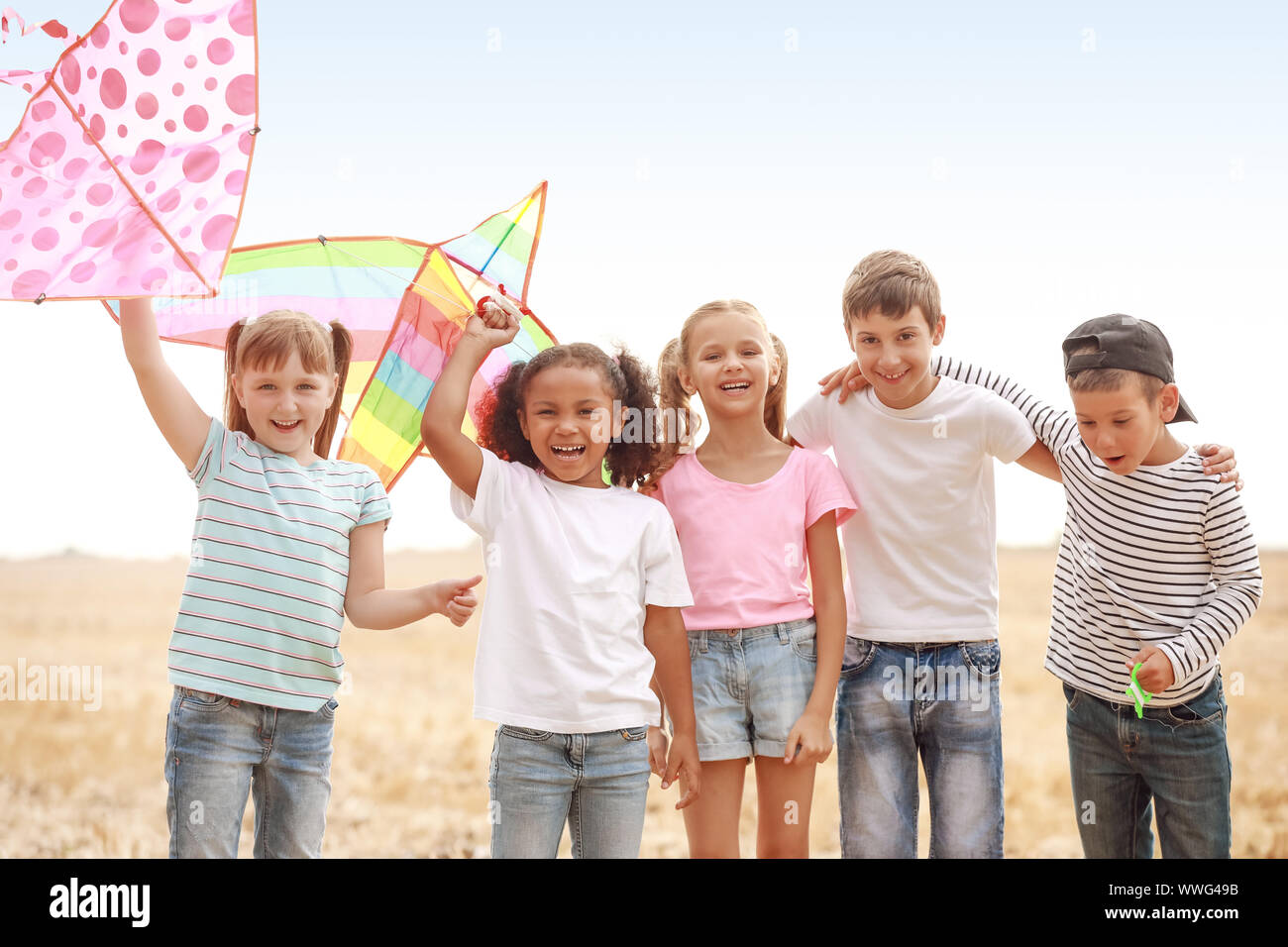 Little children flying kites outdoors Stock Photo - Alamy